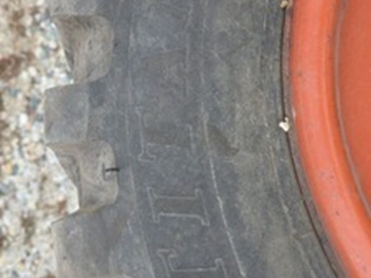 (4) 7.00-15 skid steer tires on rims by Schrader Real Estate and ...